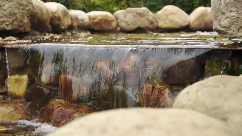 Slow Smooth Flow and Water Fall from a Decorative Lake. Stock Footage ...