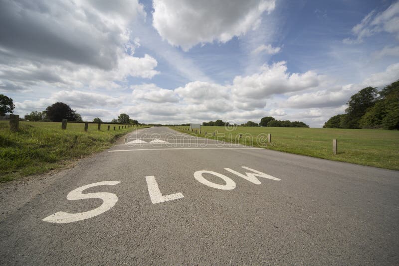 Slow written on the road stock image. Image of recover - 114265817