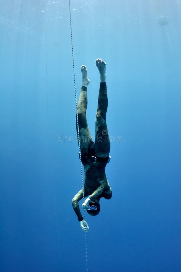 Freediver Equalizing Pressure while Moving Down Stock Image - Image of ...