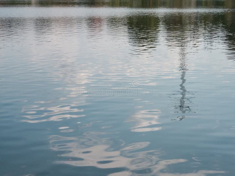 Slowly Moving Littles Waves on Water with Reflections of Clouds and ... Slowly Moving Littles Waves on Water with Reflections of Clouds and ...