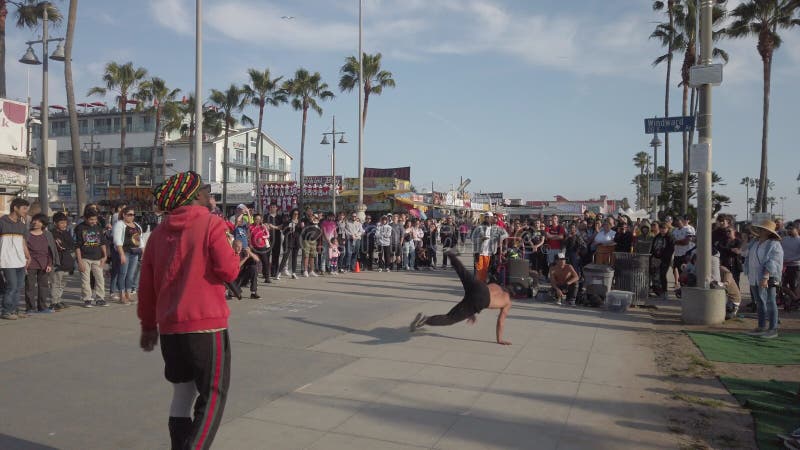 Slowm Motion Shot of a Guy Break Dancing while Others are Watching ...