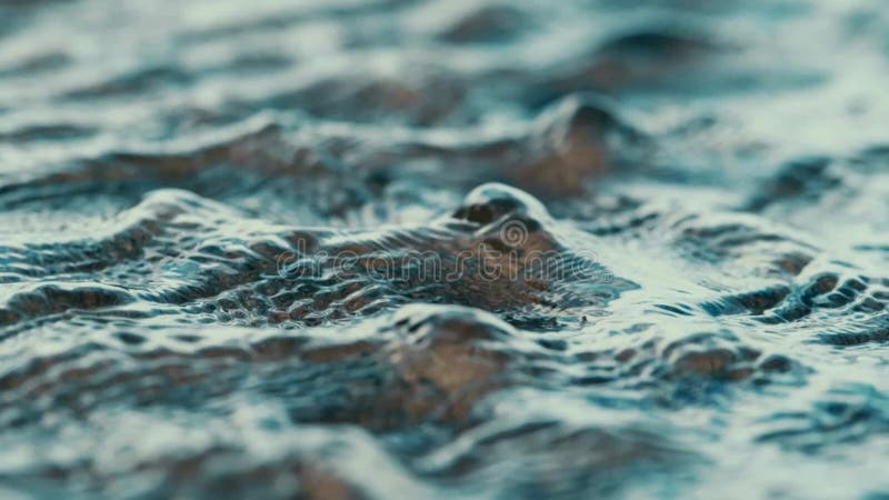 Slowmo Closeup of the Surface of a Little Stream with Reflecting Water ...
