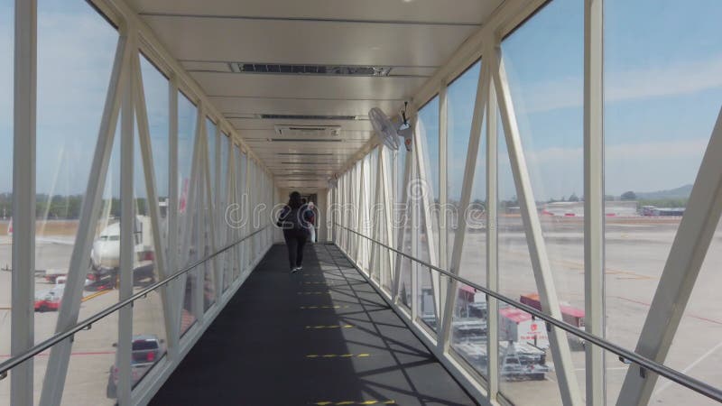 Slowmotion View while Walking on Airplane Bridge To Boarding Airplane ...