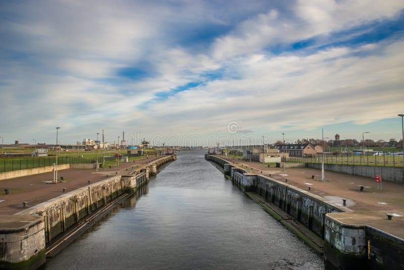 Open sluice in holland stock image. Image of boats, landscape - 135515437