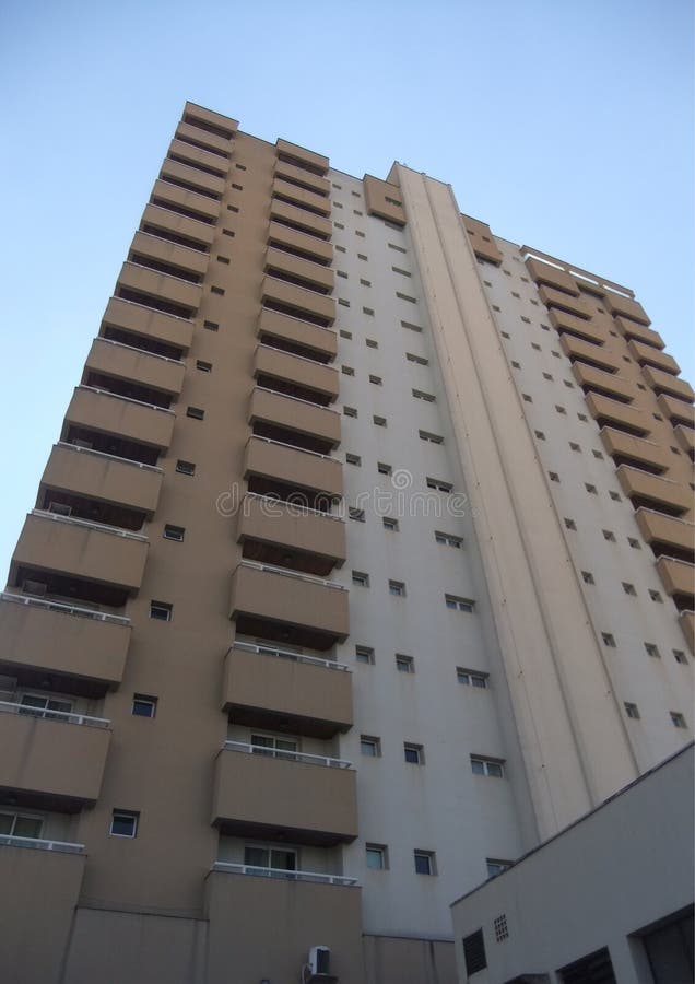 High-rise Building with a Modern Facade Featuring Beige and Light Gray ...
