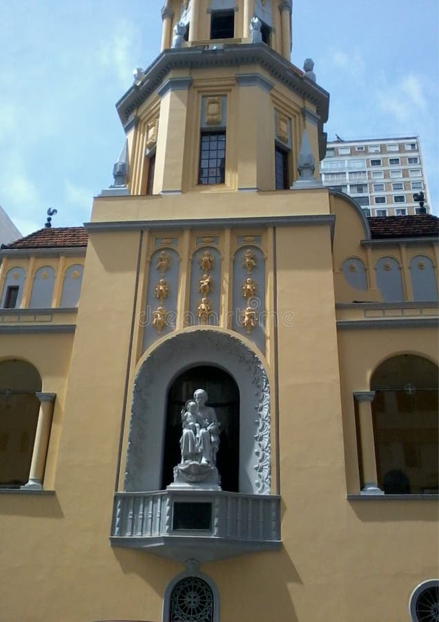 Facade of a Church Featuring a Neoclassical Design with a Warm Yellow ...