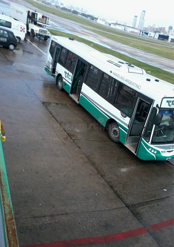 Airport Scene Showing a Shuttle Bus Marked "Handling Argentino" with ...