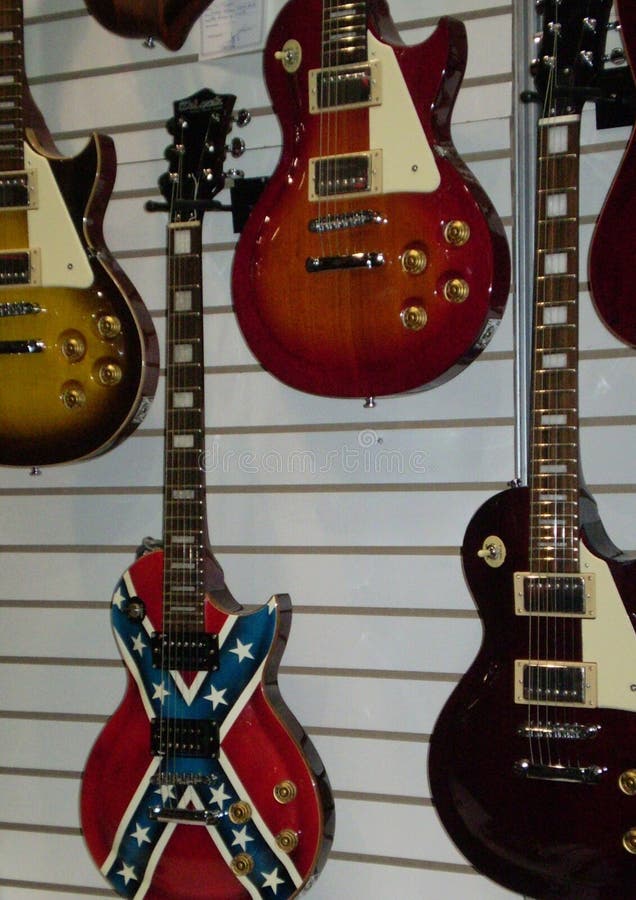 Electric Guitars Displayed on a White Slatted Wall Editorial Photo ...