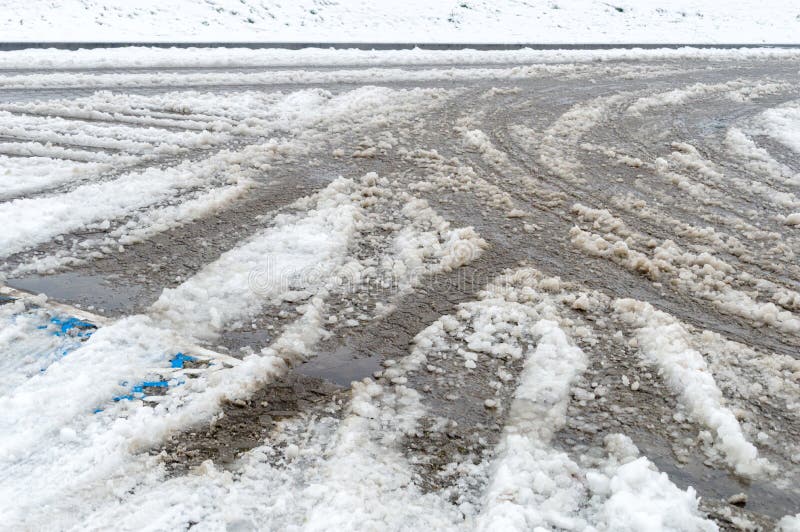 Slushy Snow Melting Away from Foot Traffic on a Sidewalk Stock Photo ...
