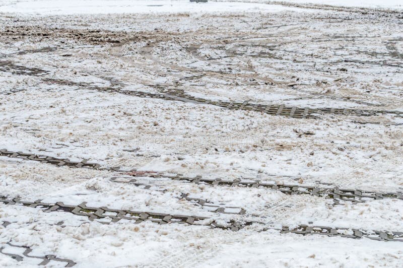 Slushy Snow Melting Away from Foot Traffic on a Sidewalk Stock Photo ...