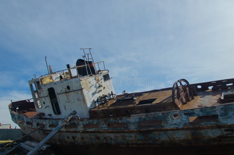 A Small Abandoned Rusty Ship Stands in the Open Air. Summer. Stock ...