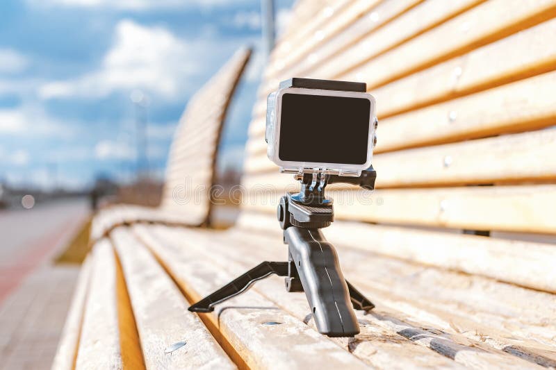 A Small Action Camera Stands on the Benches. Background of Clouds in ...