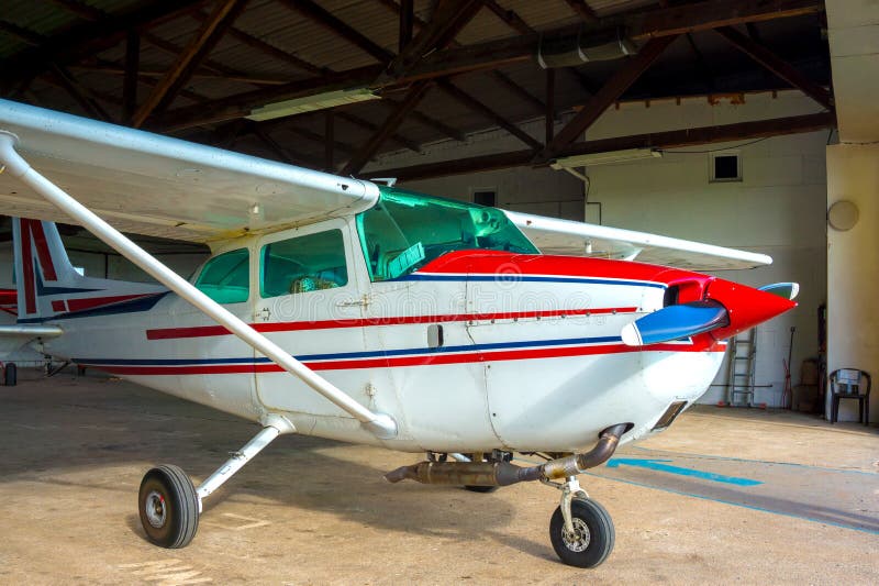 Small aircraft in a hangar stock photo. Image of modern - 95009708
