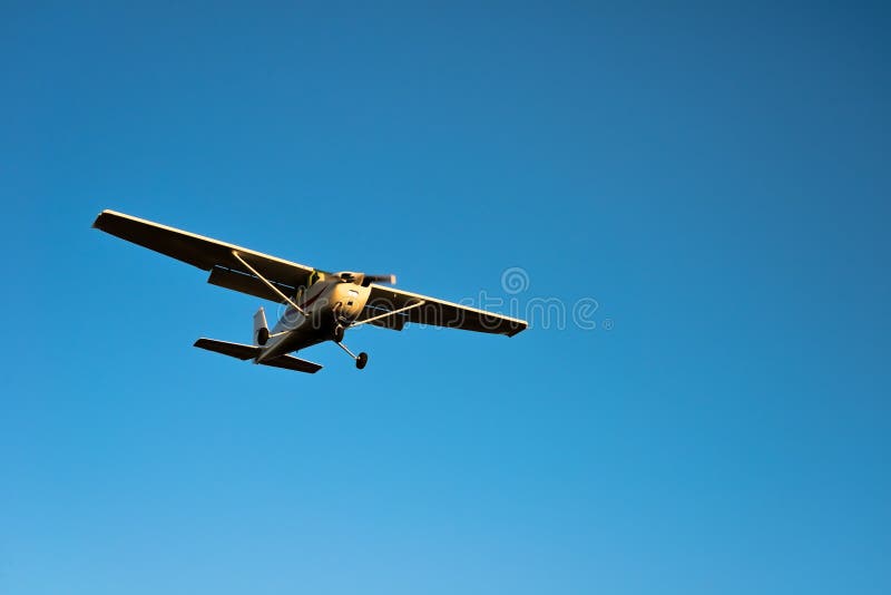 Small Airplane Approaching with Blue Sky Stock Photo - Image of flight ...