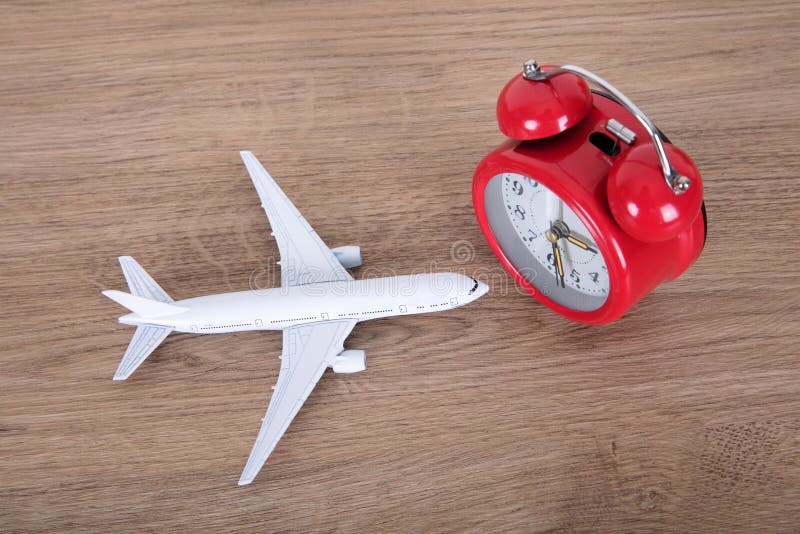 Small Airplane Model and Alarm Clock on the Table Stock Image - Image ...