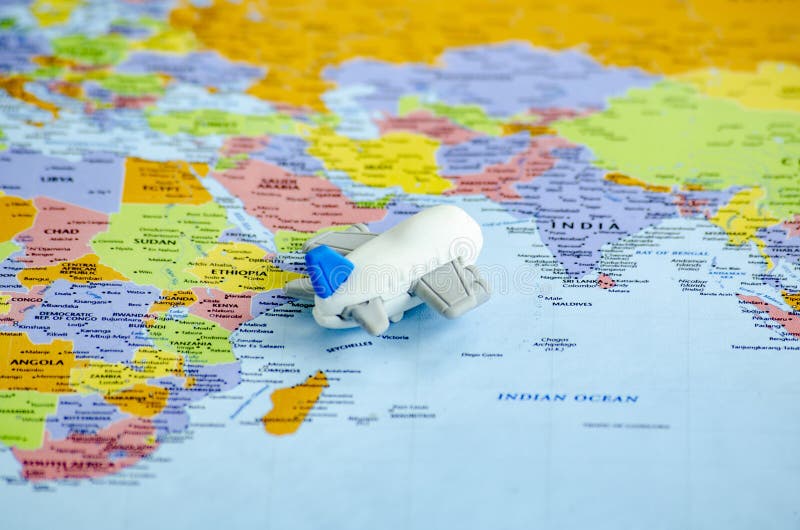 Small Airplane Placed on a World Map Representing Travel or Global ...