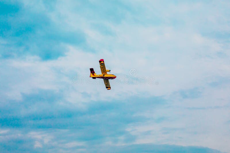 Small Airplane. Yellow Red Propeller Plane is Flying on Blue Sky Stock ...
