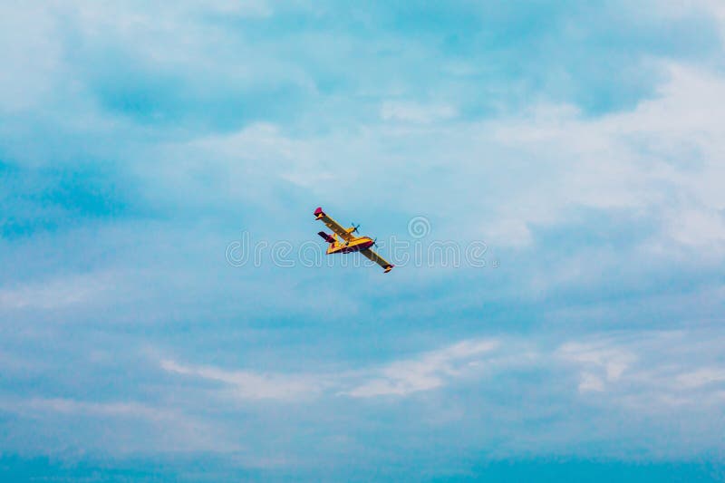Small Airplane. Yellow Red Propeller Plane is Flying on Blue Sky Stock ...