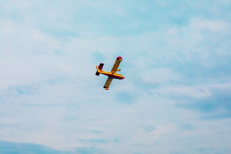 Small Airplane. Yellow Red Propeller Plane is Flying on Blue Sky Stock ...