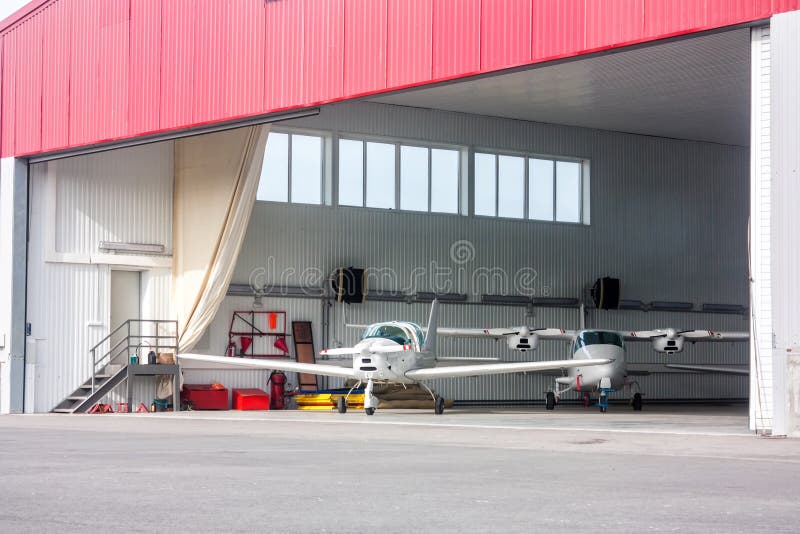 Small Aircraft in Open Hangar Stock Photo - Image of airplane, tool ...