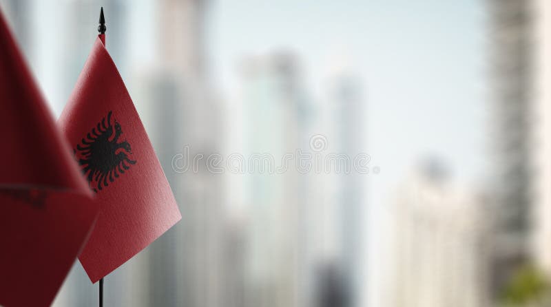 A Small Albania Flag on an Abstract Blurry Background Stock Photo ...