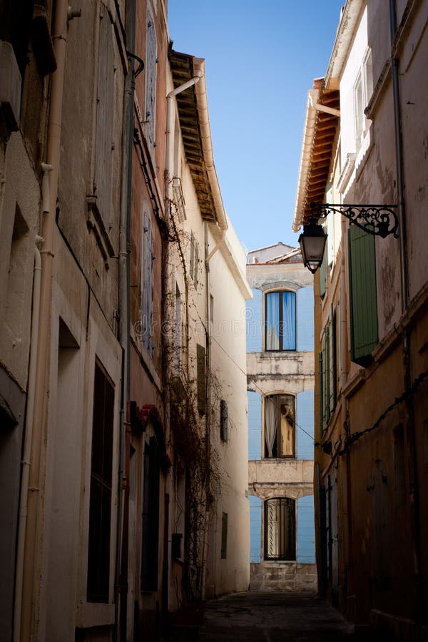 Alley in Arles France with Bright Blue Shutters Stock Photo - Image of ...