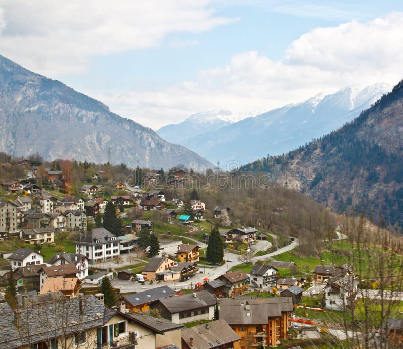 Small Alpine Village in Switzerland Stock Image - Image of blue, season ...