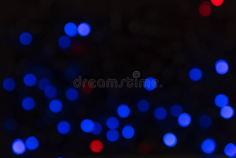 A Small Amount of Blue and Very Rare Red Light Confetti on a Black ...