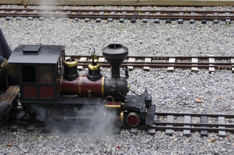 Small Antique Steam Train Engine on Tracks Stock Photo - Image of ...