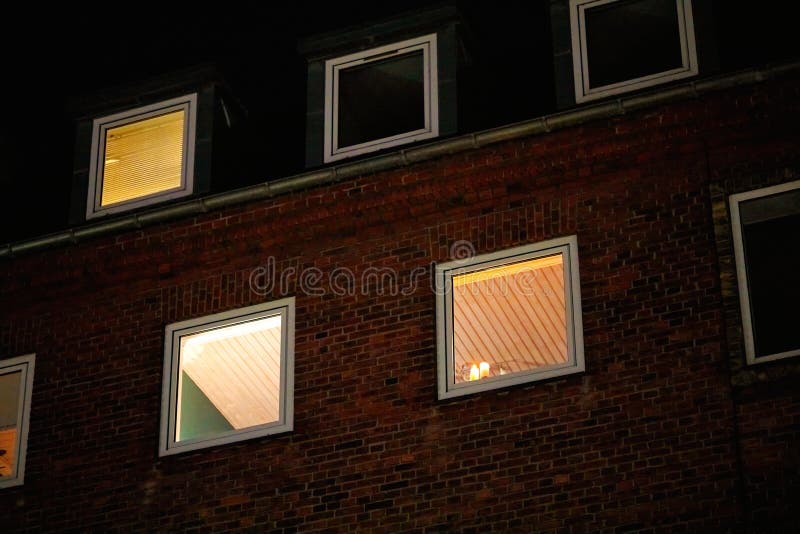 Small Apartment Windows with Lights on at Night Stock Photo - Image of ...