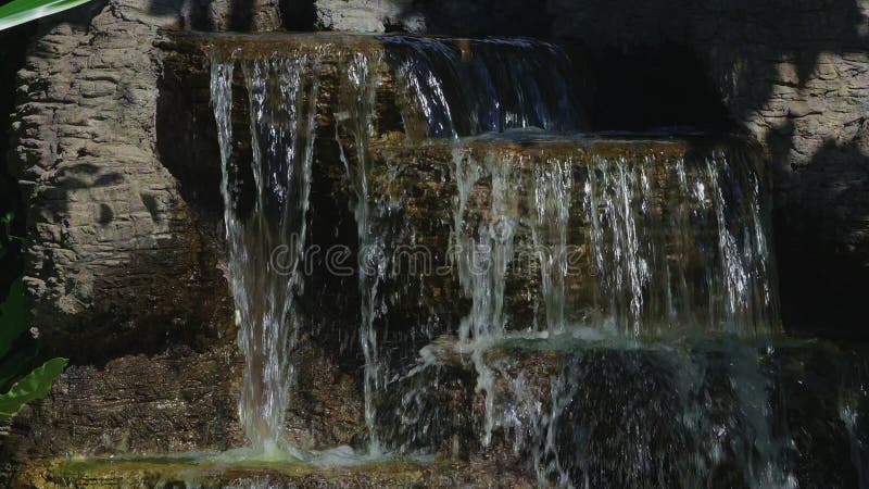 Artificial cascade flowing stock video. Video of rock - 365237213