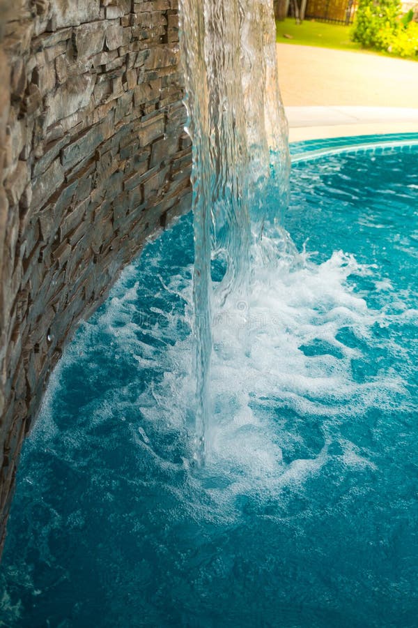 Small Artificial Waterfall in the Swimming Pool Stock Image - Image of ...