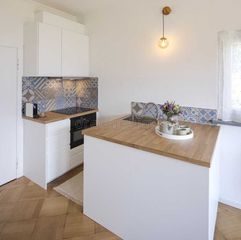 Small Artistic Kitchen with a Wooden Top and a Tray with a Kettle and ...