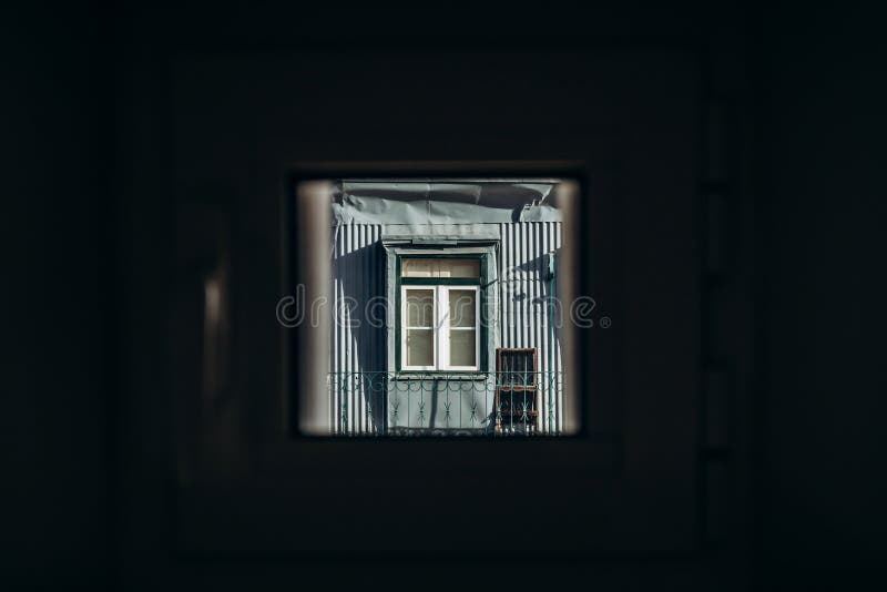 A Small Attic Window Seen through Another Small Attic Window in Lisbon ...