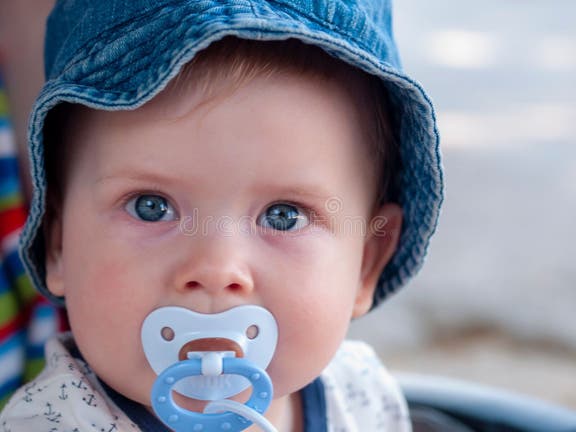 Baby boy with pacifier stock photo. Image of chubby - 270845764