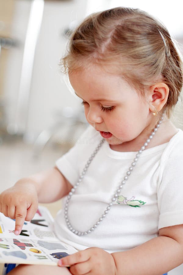 Small baby reading a book stock photo. Image of family - 1784836