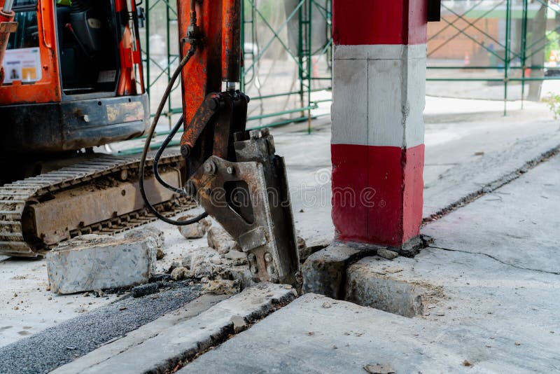 Small Backhoe Robot Use a Pointed Forearm., To Drill Concrete Slabs ...