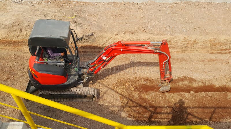 Small Backhoe is Working Digging Down the Ground Stock Photo - Image of ...