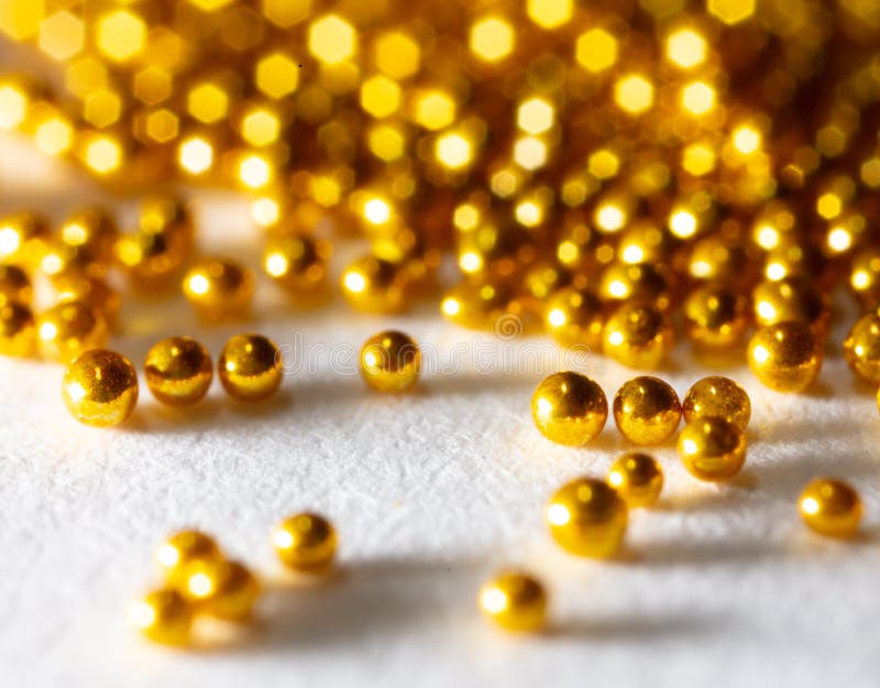 Small Balls of Gold on a White Background Stock Photo - Image of golden ...