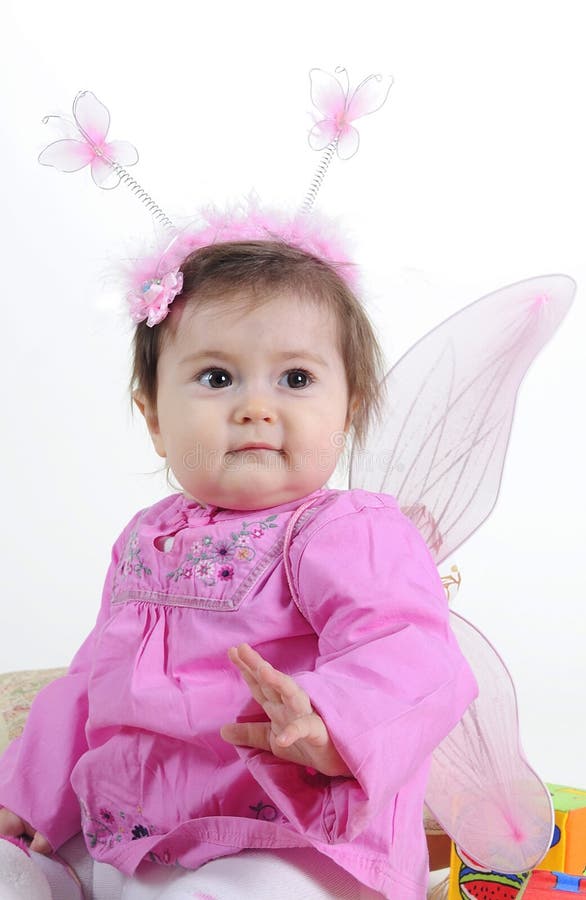 The Small Beautiful Girl in Pink Clothes Stock Photo - Image of ...