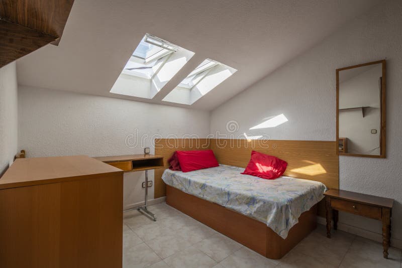 Small Bedroom with Single Bed, Study Table and Skylights Stock Image ...