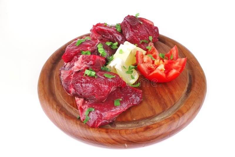 Small Beef Chunks on Wooden Plate Stock Photo - Image of edible, lemon ...