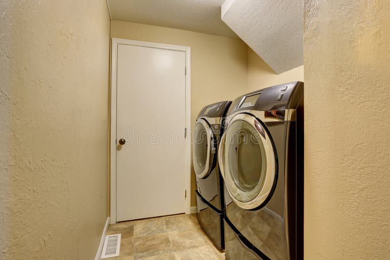 Small Beige Laundry Room with Modern Appliances Stock Image - Image of ...
