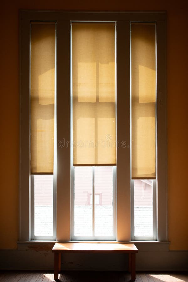 Small Bench in Front of Dramatic Bright Windows Stock Photo - Image of ...