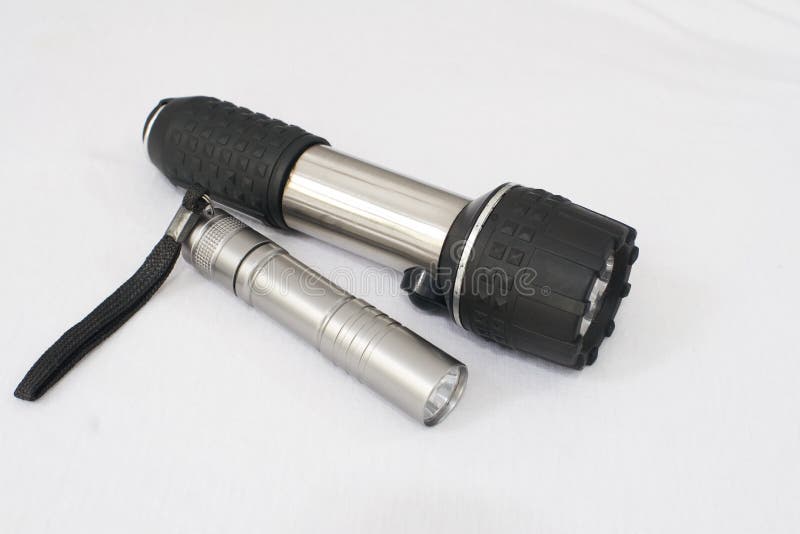 A Silver Mini Flashlight and a Big LED Flashlight Stock Image - Image ...