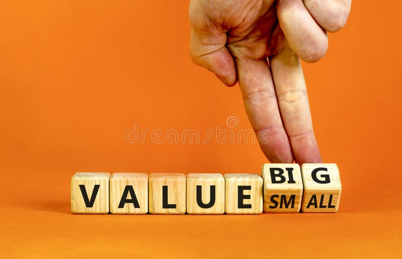 Small or Big Value Symbol. Businessman Turns Wooden Cubes and Changes ... Small or Big Value Symbol. Businessman Turns Wooden Cubes and Changes ...