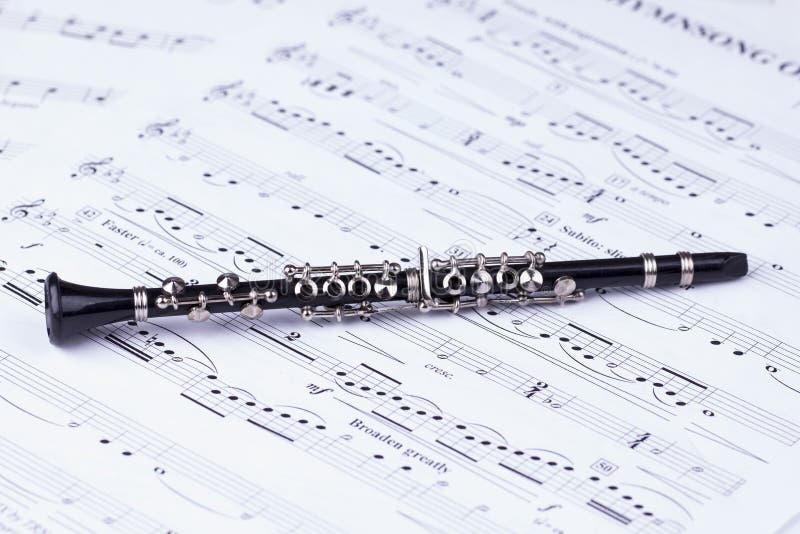 Small Black Clarinet on Notes Stock Photo - Image of metal, ligature ...