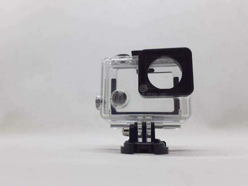 A Small Black and Grey Action Camera with Its Accessories on White ...