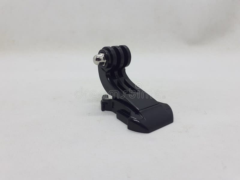 A Small Black and Grey Action Camera with Its Accessories on White ...