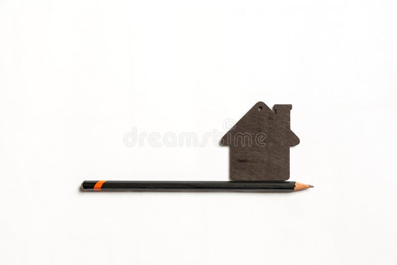 Small Black Model of a House with Black Pencil on a White Background ...